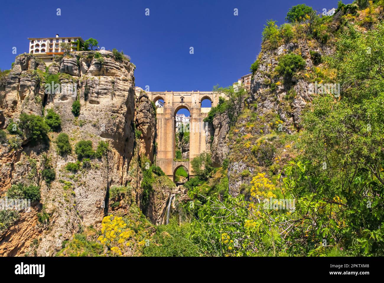 The picturesque town of Ronda with the Puente Nuevo that spectacularly bridges the gorge in the ...