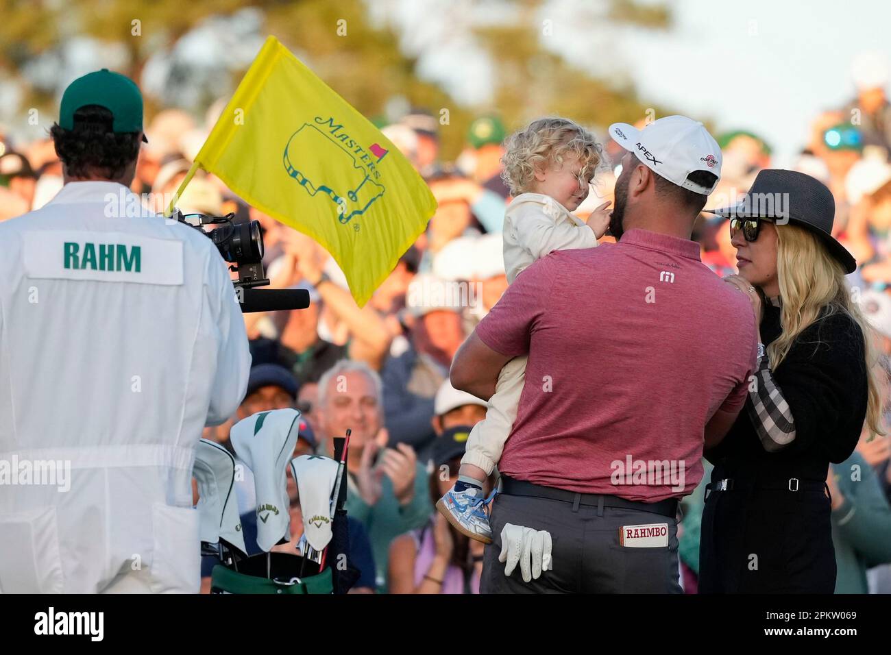 Jon Rahm, of Spain, celebrates with his wife Kelley Cahill and their ...
