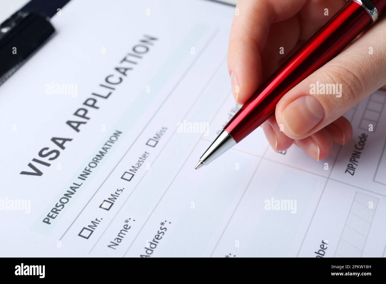 Woman filling visa application form for immigration, closeup Stock ...