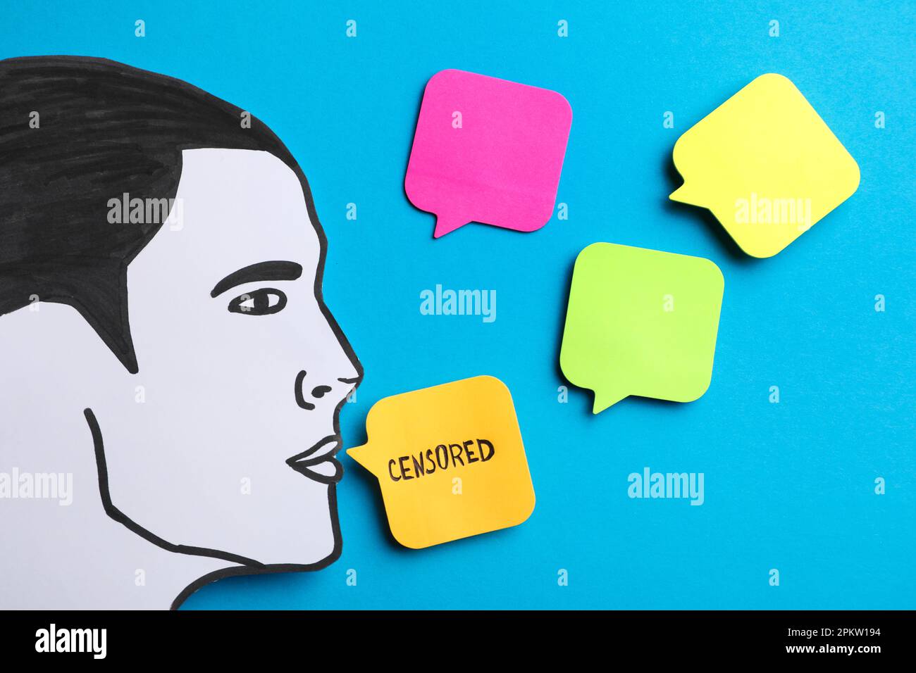 Notes with word Censored and man's head cutout on light blue background ...