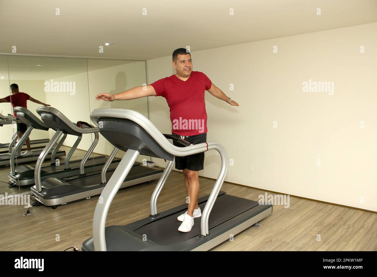Fat man on treadmill hi-res stock photography and images - Alamy
