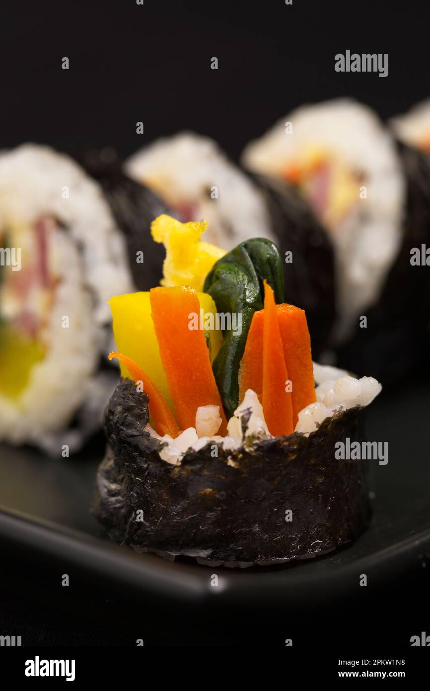 A close up of the end piece of a Korean treat called Kimbap. Food made ...