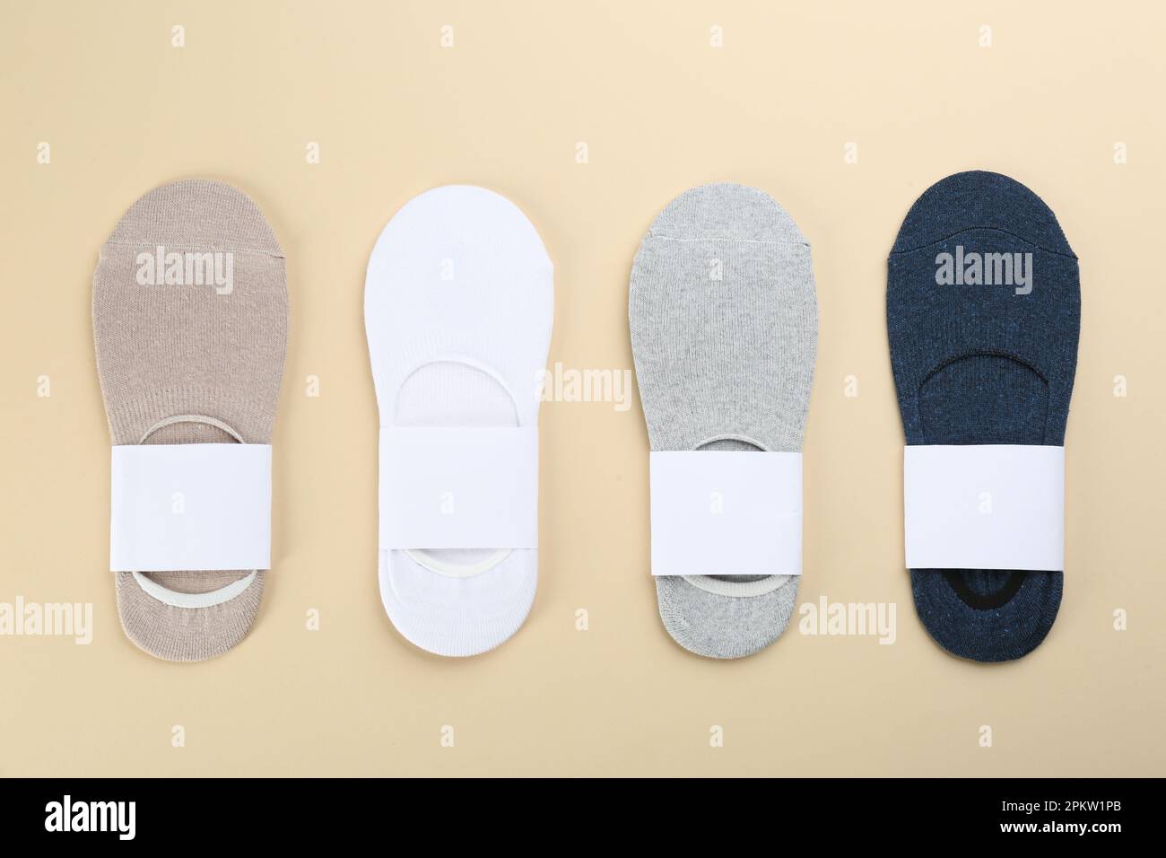 Soft cotton socks on beige background, flat lay Stock Photo - Alamy