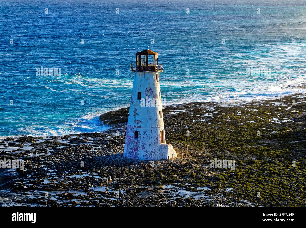An old lighthouse on a point of land in the Bahamas near Nassau Stock ...