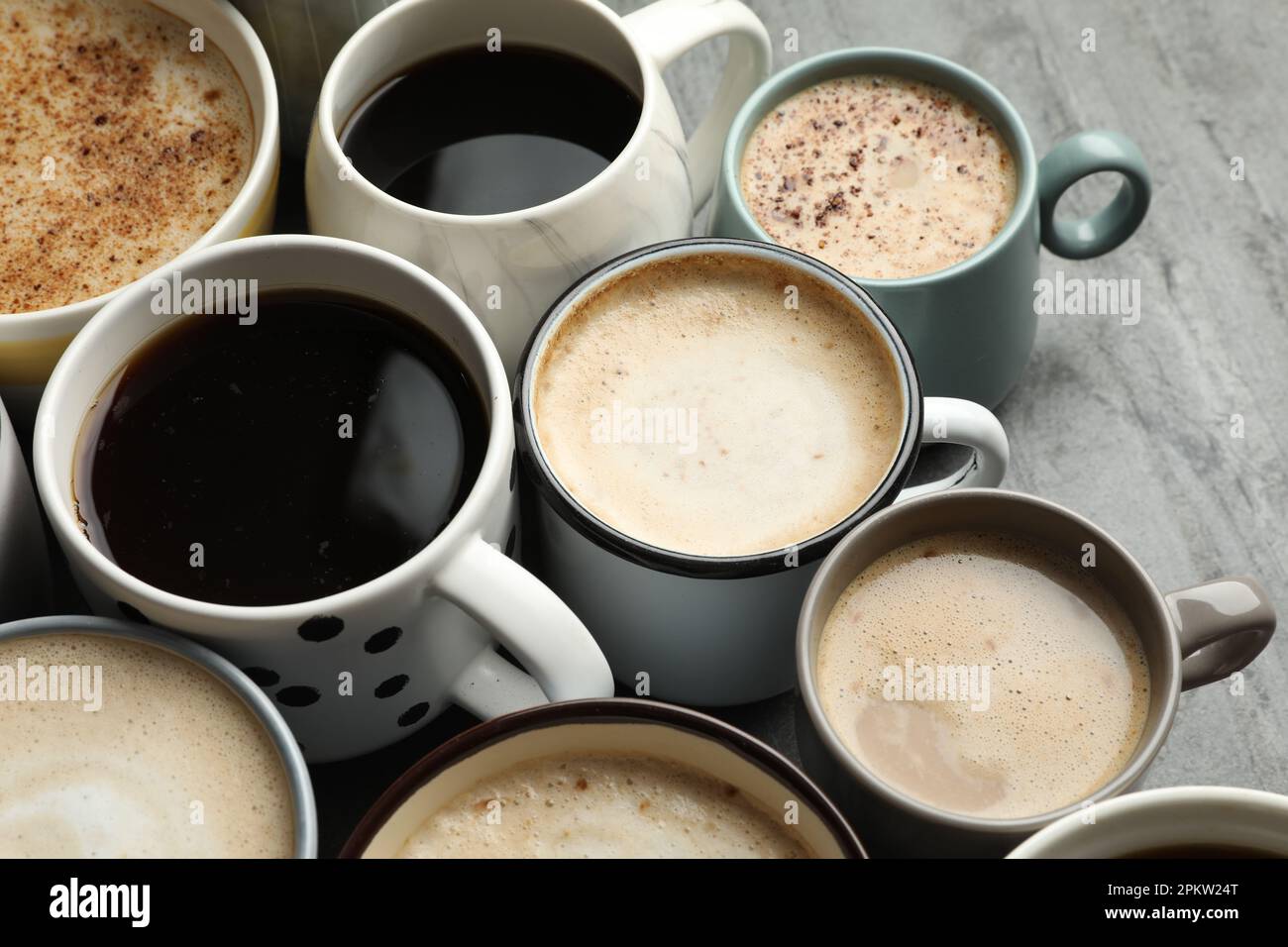 Many cups of different coffees on slate table Stock Photo - Alamy