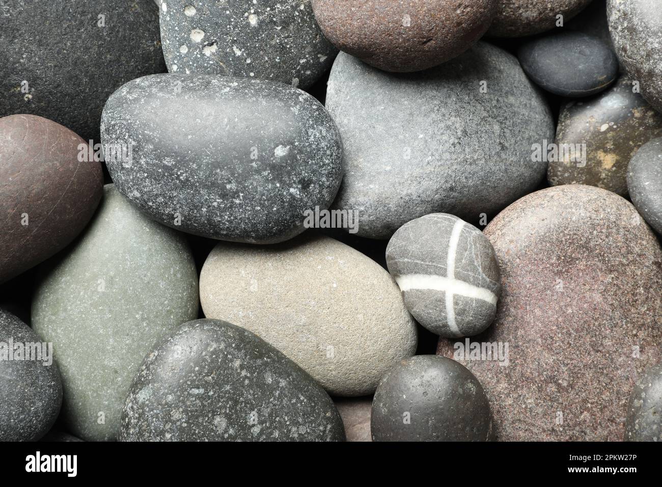 Many different stones as background, top view Stock Photo - Alamy