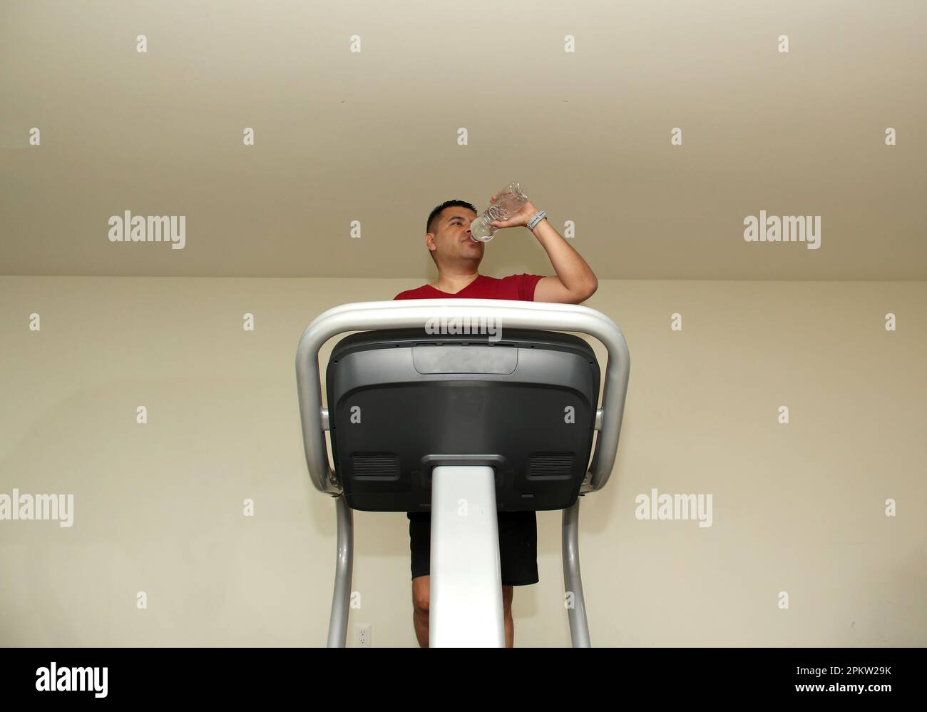 Fat man on treadmill hi-res stock photography and images - Alamy