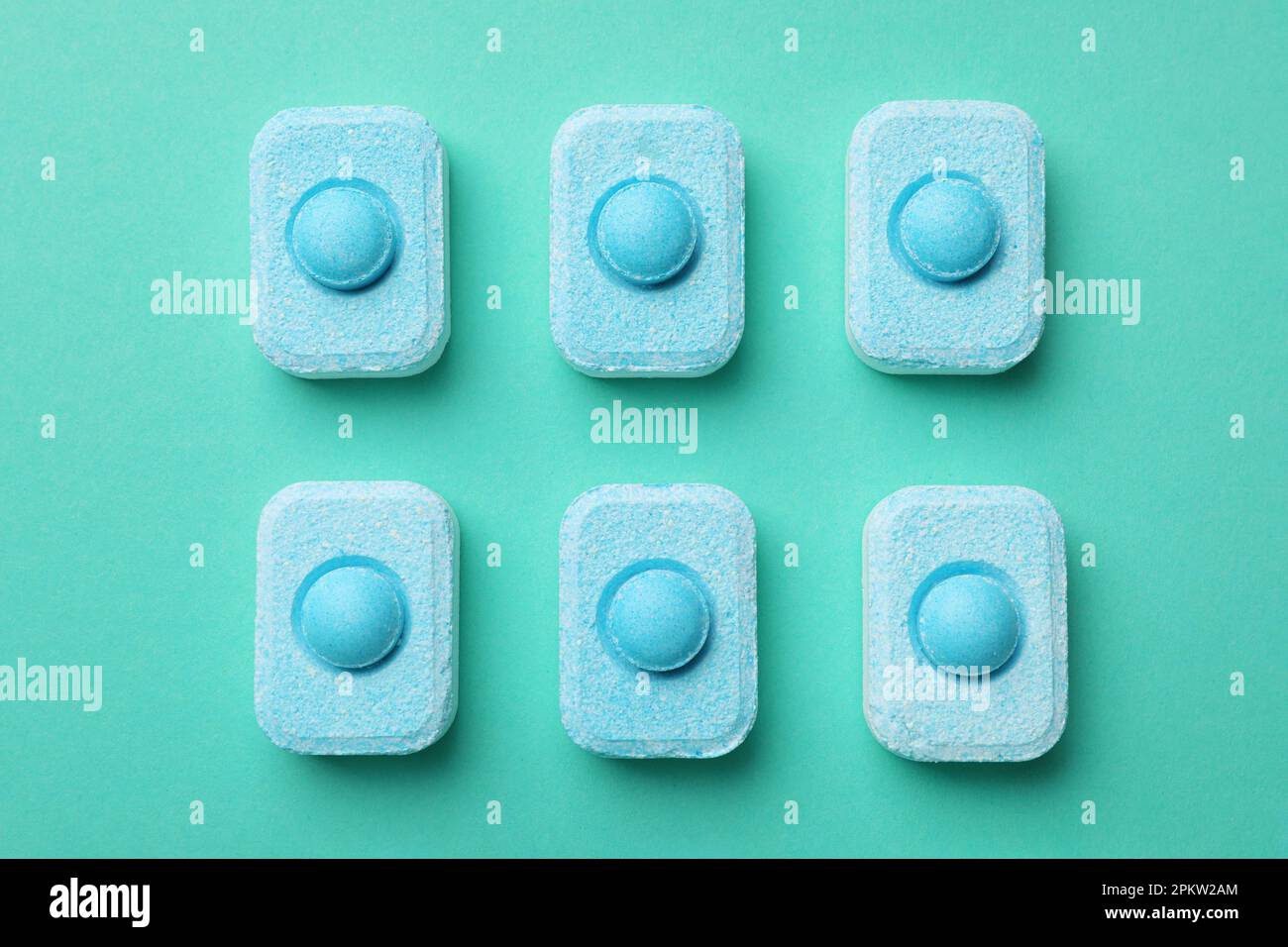 Water softener tablets on turquoise background, flat lay Stock Photo ...