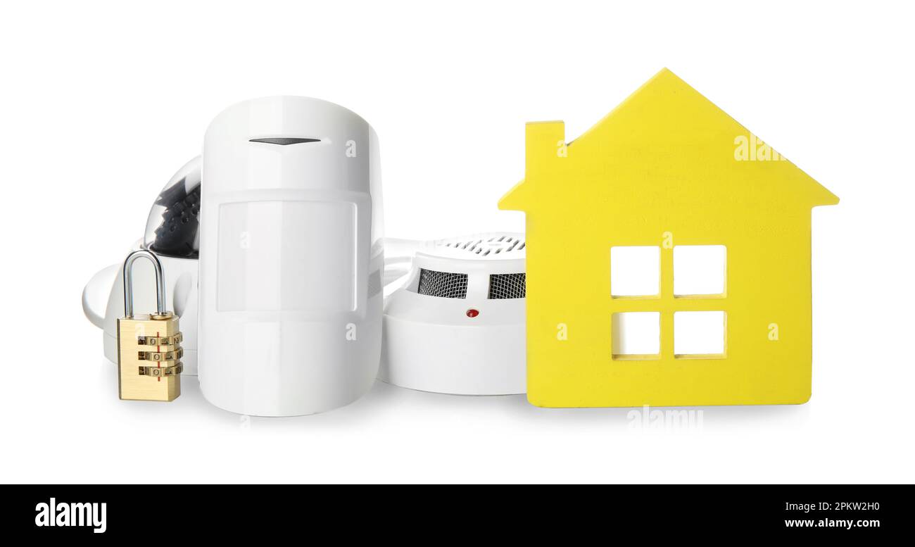 House model, CCTV camera, lock, smoke and movement detectors on white ...