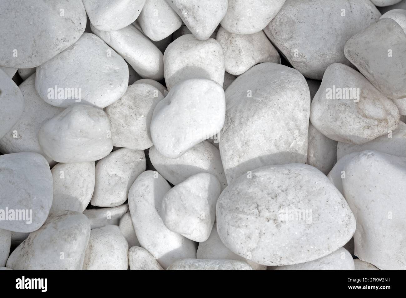 Pile of white stones as background, top view Stock Photo - Alamy