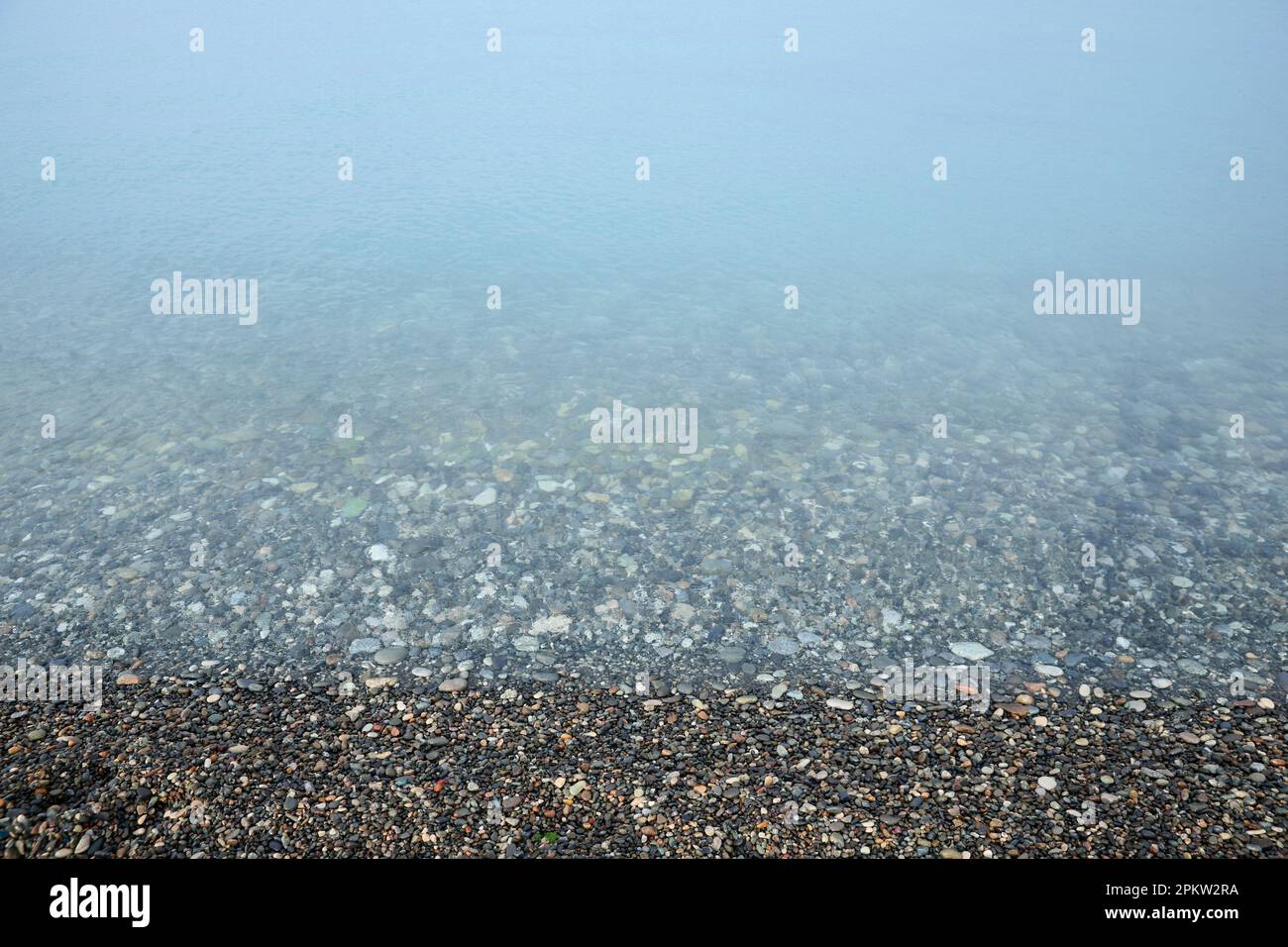 Beautiful view of sea tide on shingle beach. Summer vacation Stock ...