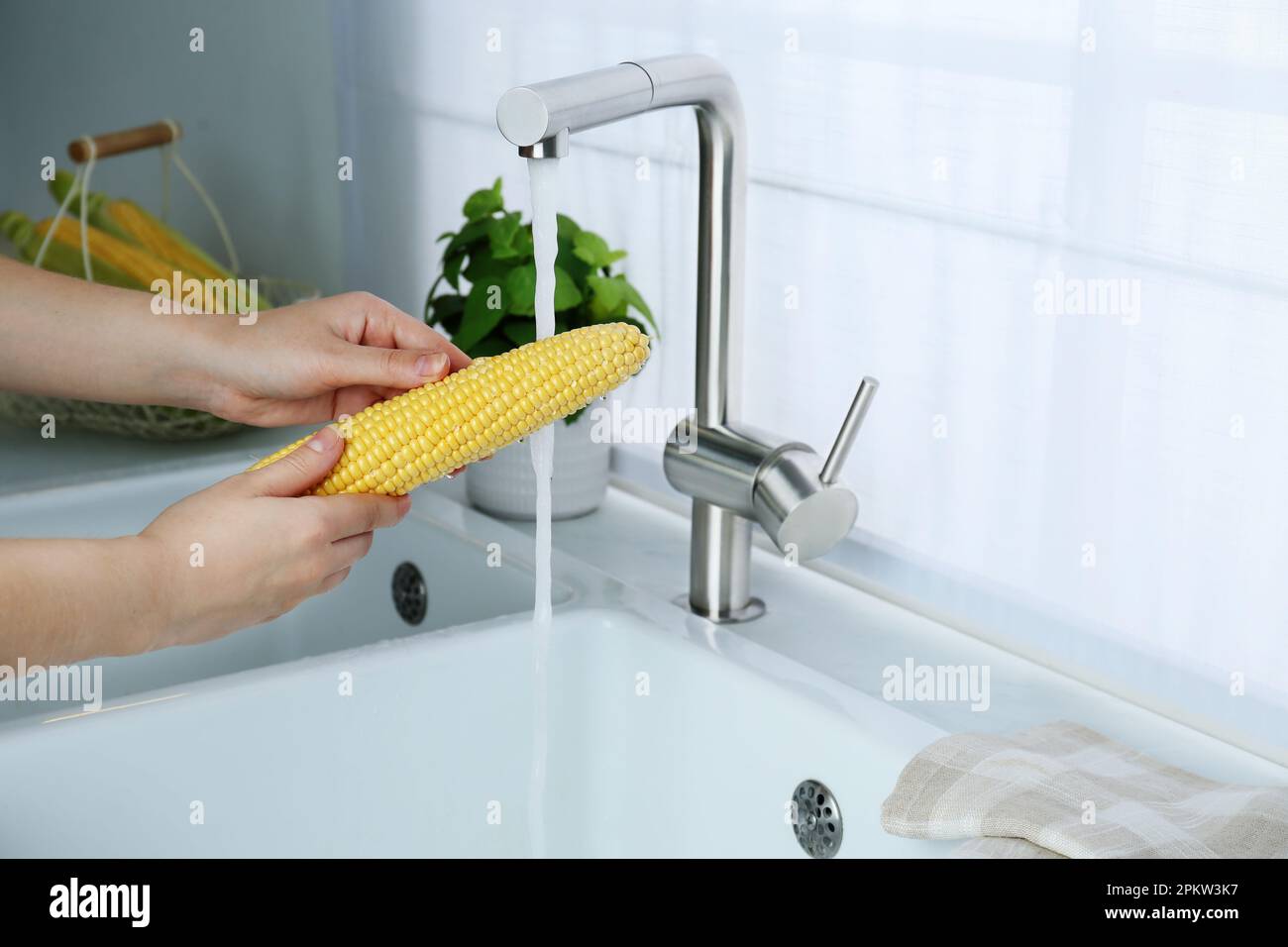 Washing corn hi-res stock photography and images - Alamy