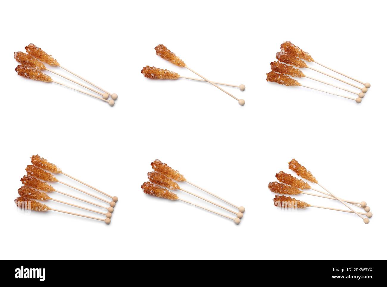 Set of wooden sticks with sugar crystals on white background. Tasty ...