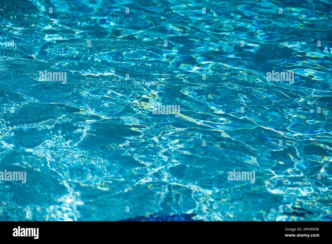 Background of blue water in swimming pool with sun reflection, ripple ...