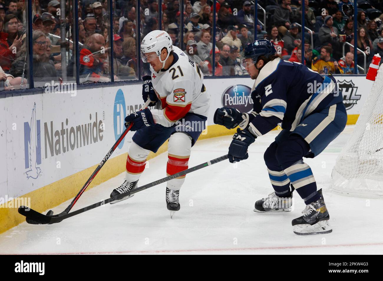 Florida Panthers forward Nick Cousins, left, works for the puck in ...