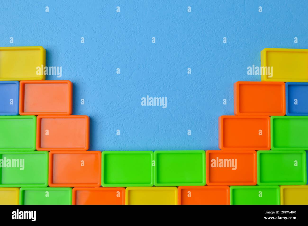 Plastic toy building blocks isolated on a blue background Stock Photo ...