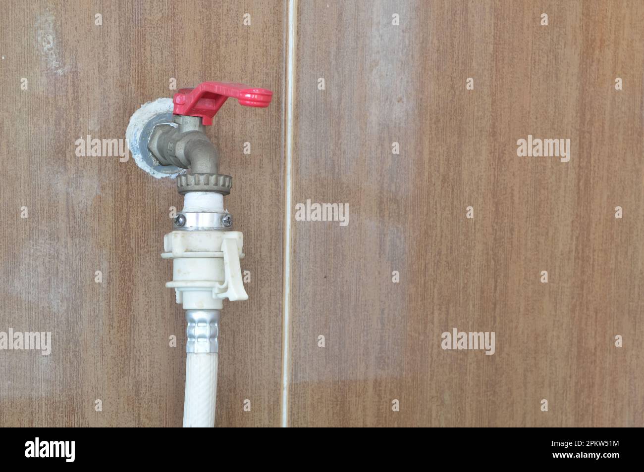 Water hose connection set for washing machine running into a wall ...