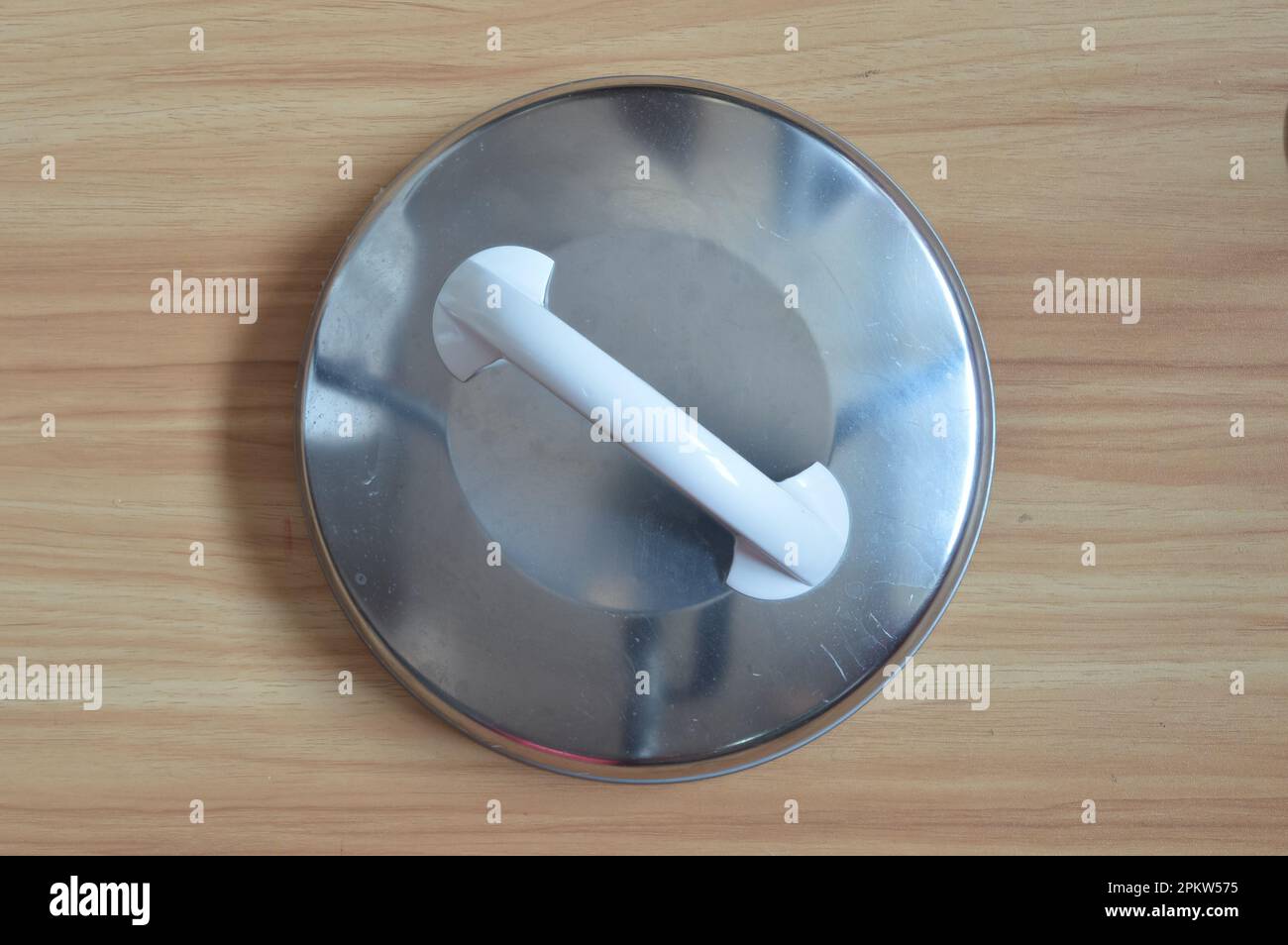 Rice cooker steel cover isolated on a white background Stock Photo - Alamy