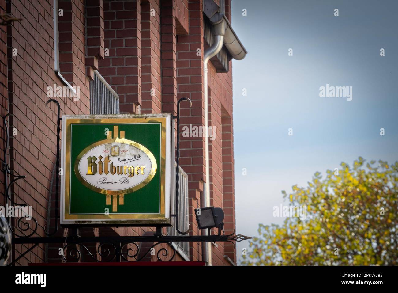 Picture of a sign with the logo of Bitburger beer on their main ...