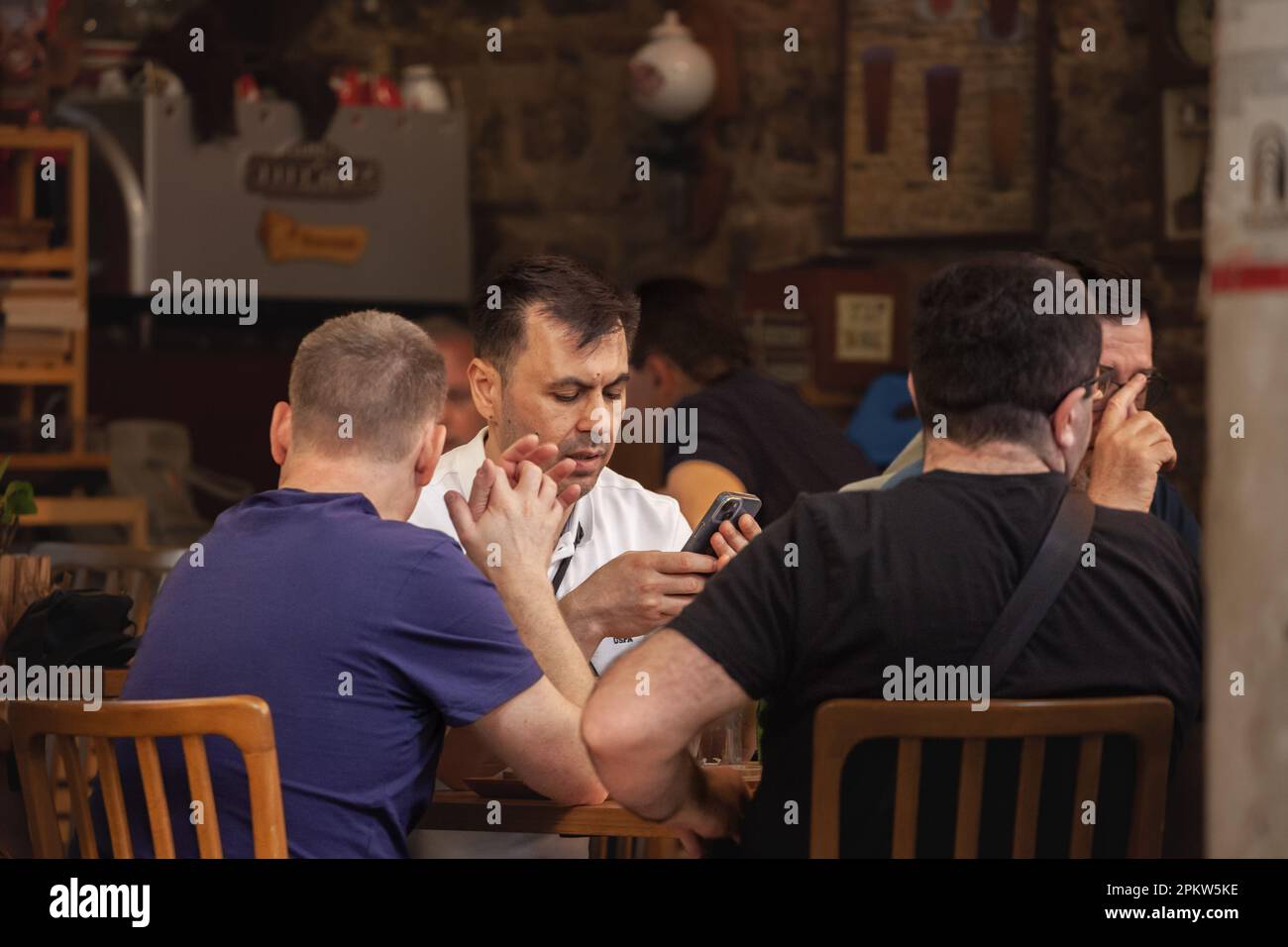 Picture of men in a turkish restaurant of istanbul, turkey, some eating ...