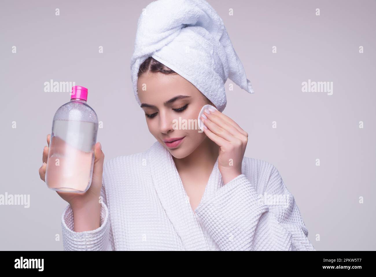 Removing makeup with cotton pads. Cleaning face with pad. Cosmetic ...