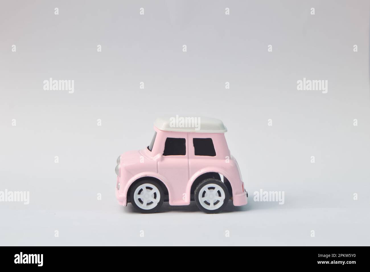 Pink toy car hi-res stock photography and images - Alamy