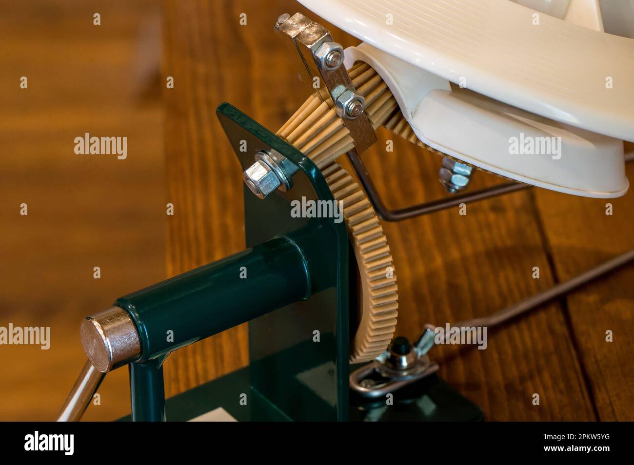 Mechanical yarn winder or reel used in knitting. Close-up, of the gear ...