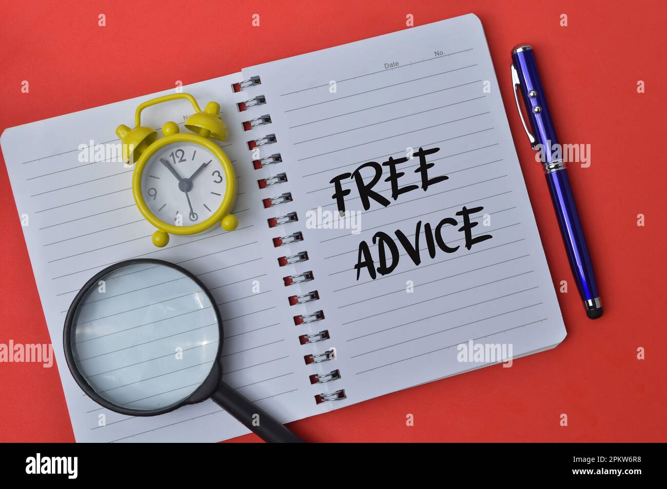 Notebook written with text FREE ADVICE isolated on a red background ...