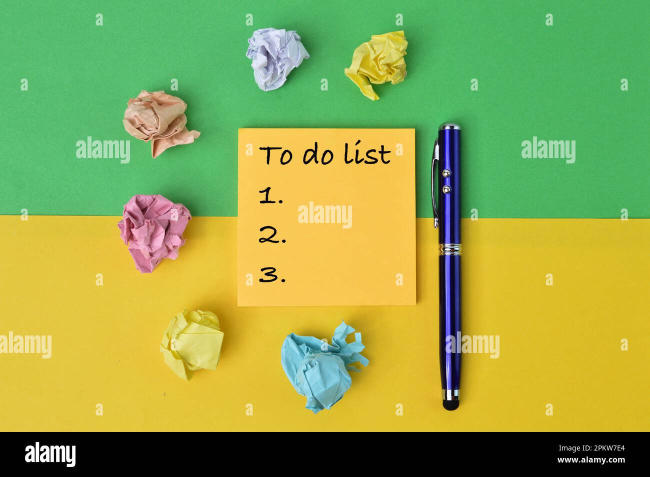 Waste papers, pen and memo note written with TO DO LIST. Business ...