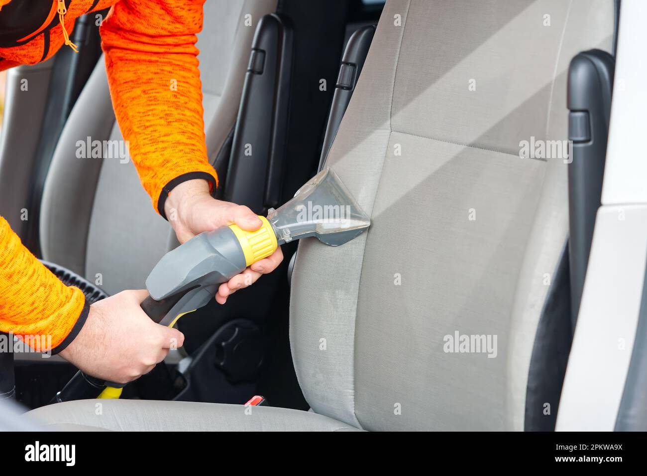 car dry cleaning. Light gray textile seats chemical cleaning with ...