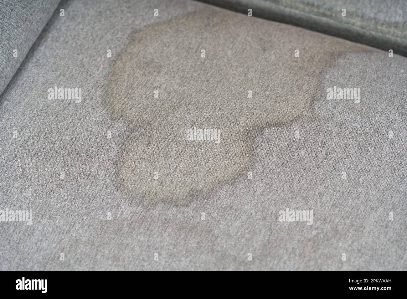 Dirty, stain, blot, fleck of water on the fabric, textile sofa. Dirty ...