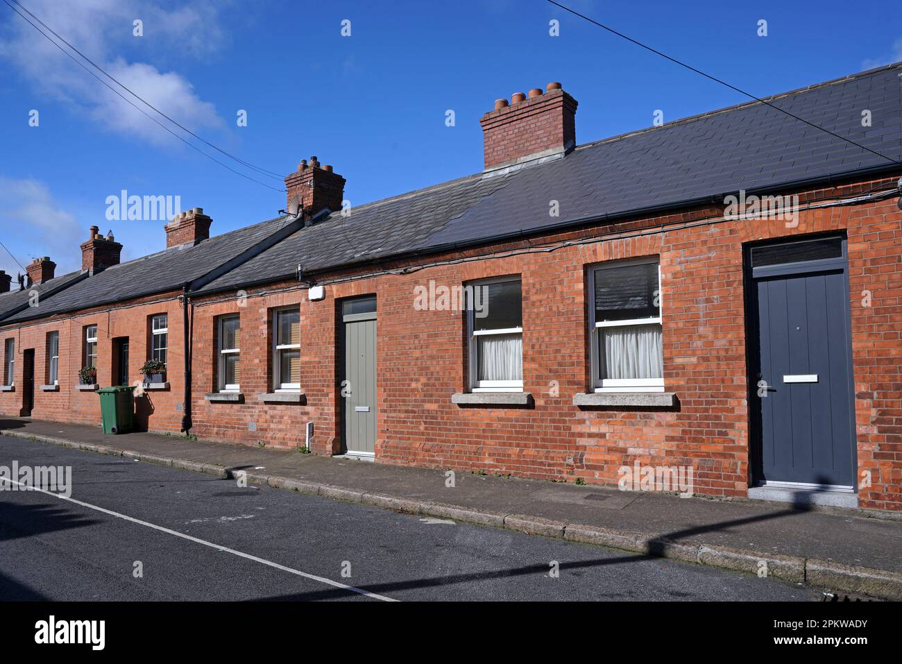 Row of small working class one story houses Stock Photo - Alamy