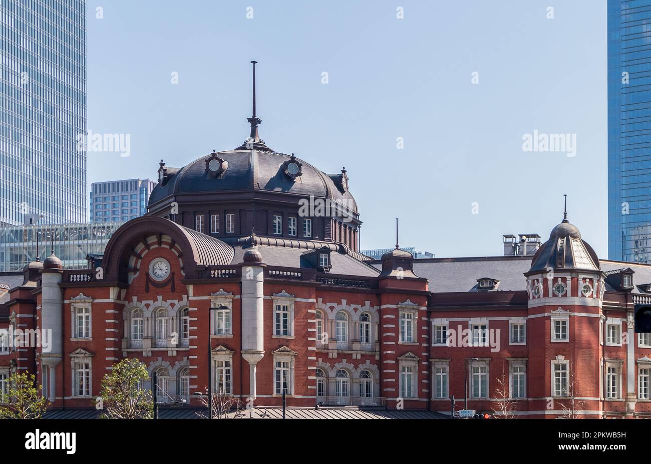 Historical Tokyo station building and modern skyscrapers around in ...