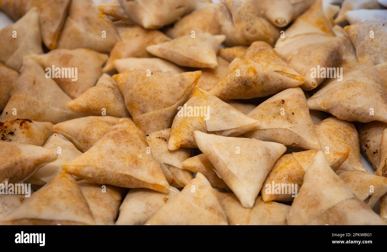 Samosas fresh oven baked for appetizers Stock Photo - Alamy