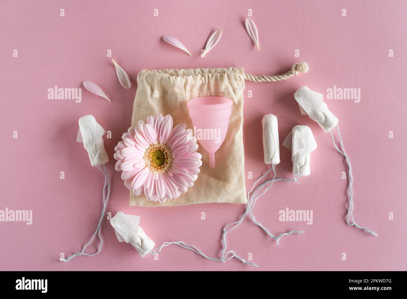Tampons and menstrual cup on pink background Stock Photo - Alamy