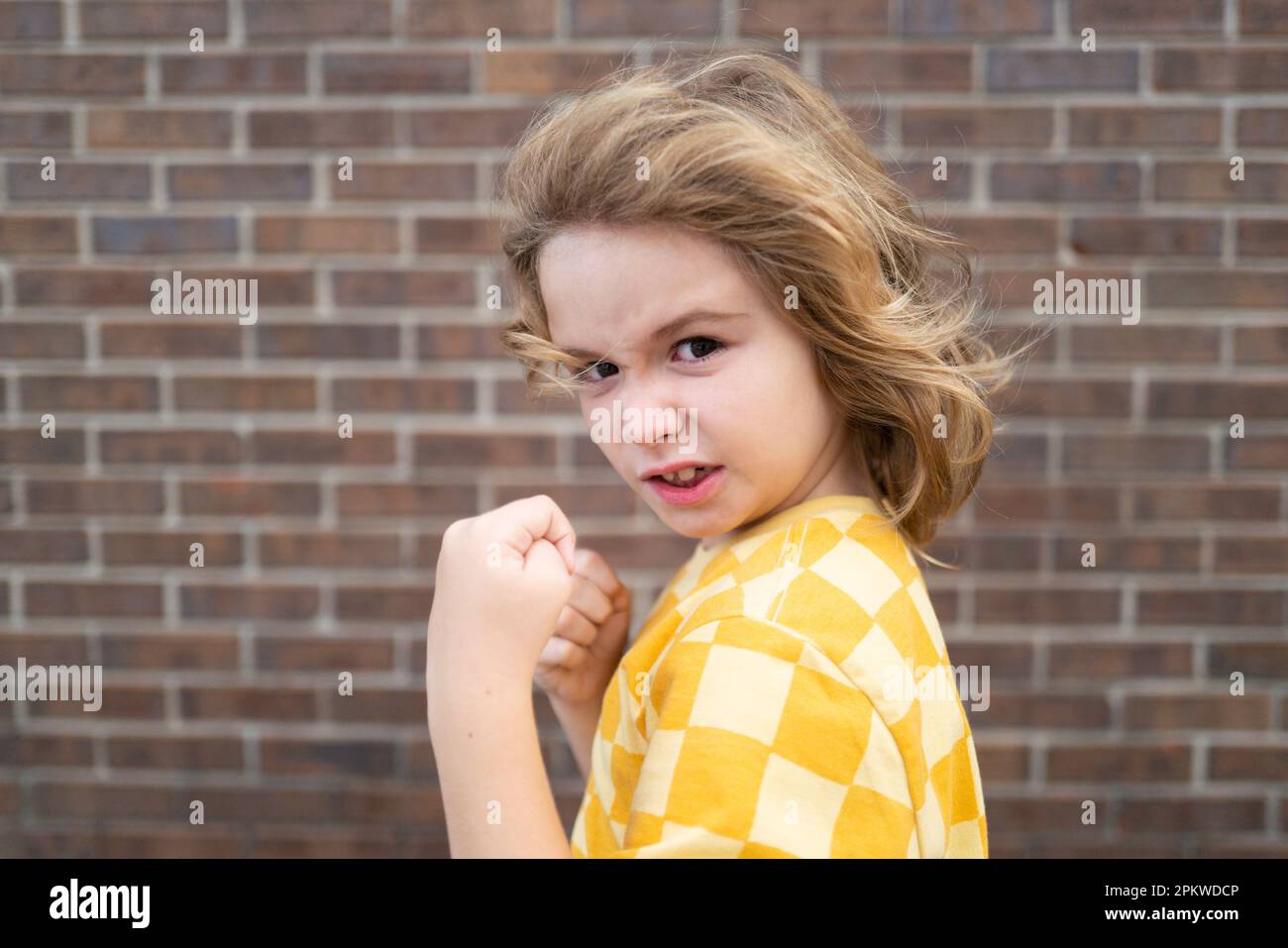 Child temper with angry expression. Angry hateful little anger boy ...