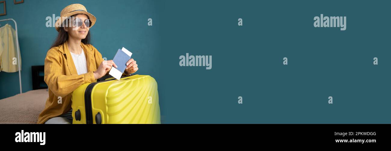 Happy female traveler getting ready for holiday with happy face ...