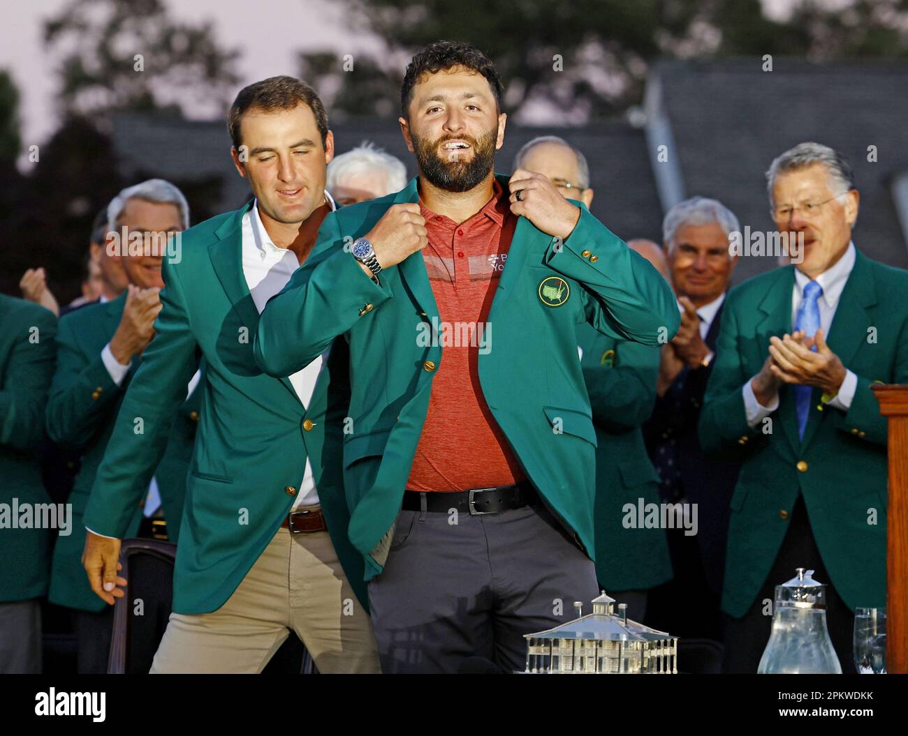 New Masters champion Jon Rahm (R) of Spain puts on his green jacket ...