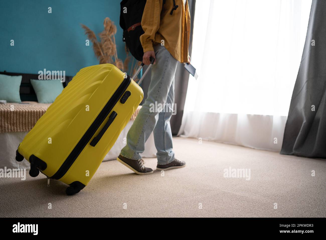 Tourist woman with her luggage in hotel bedroom after check-in. Woman ...