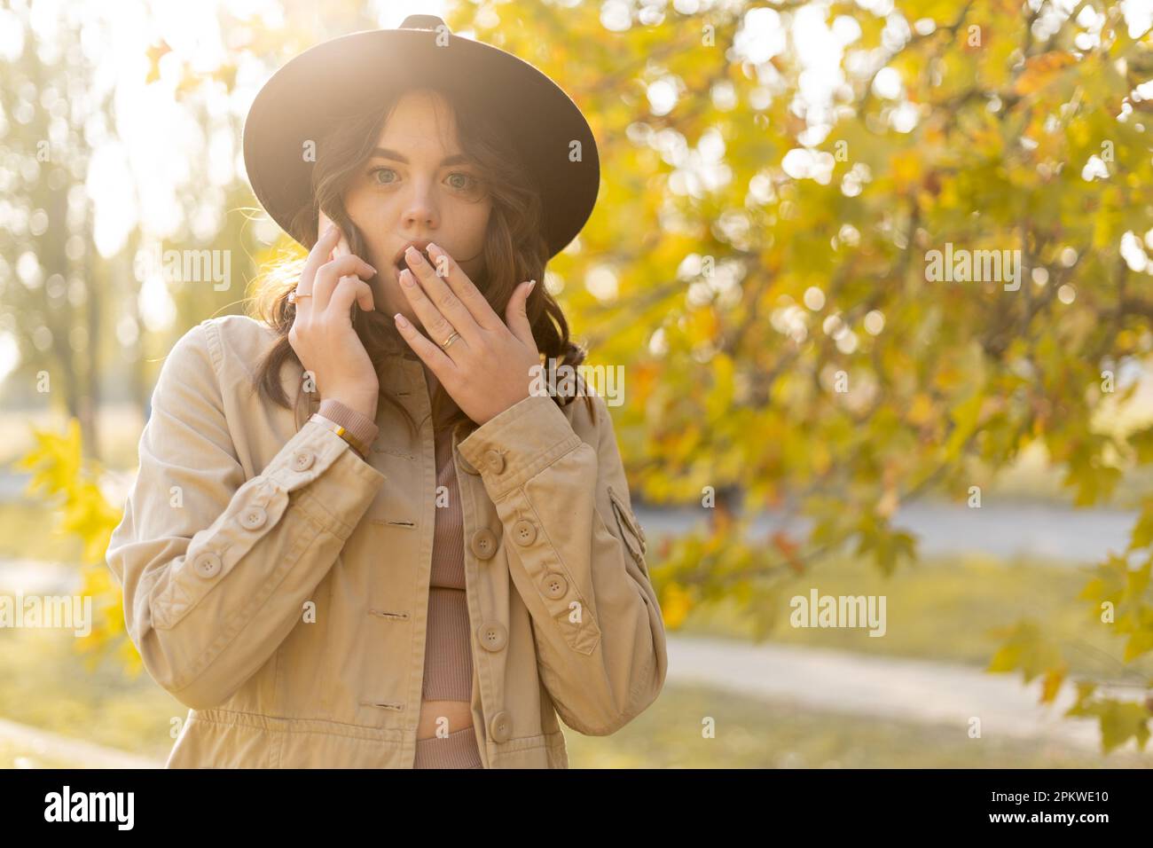 Shocked woman hearing bad news over phone, scared female amazed by ...