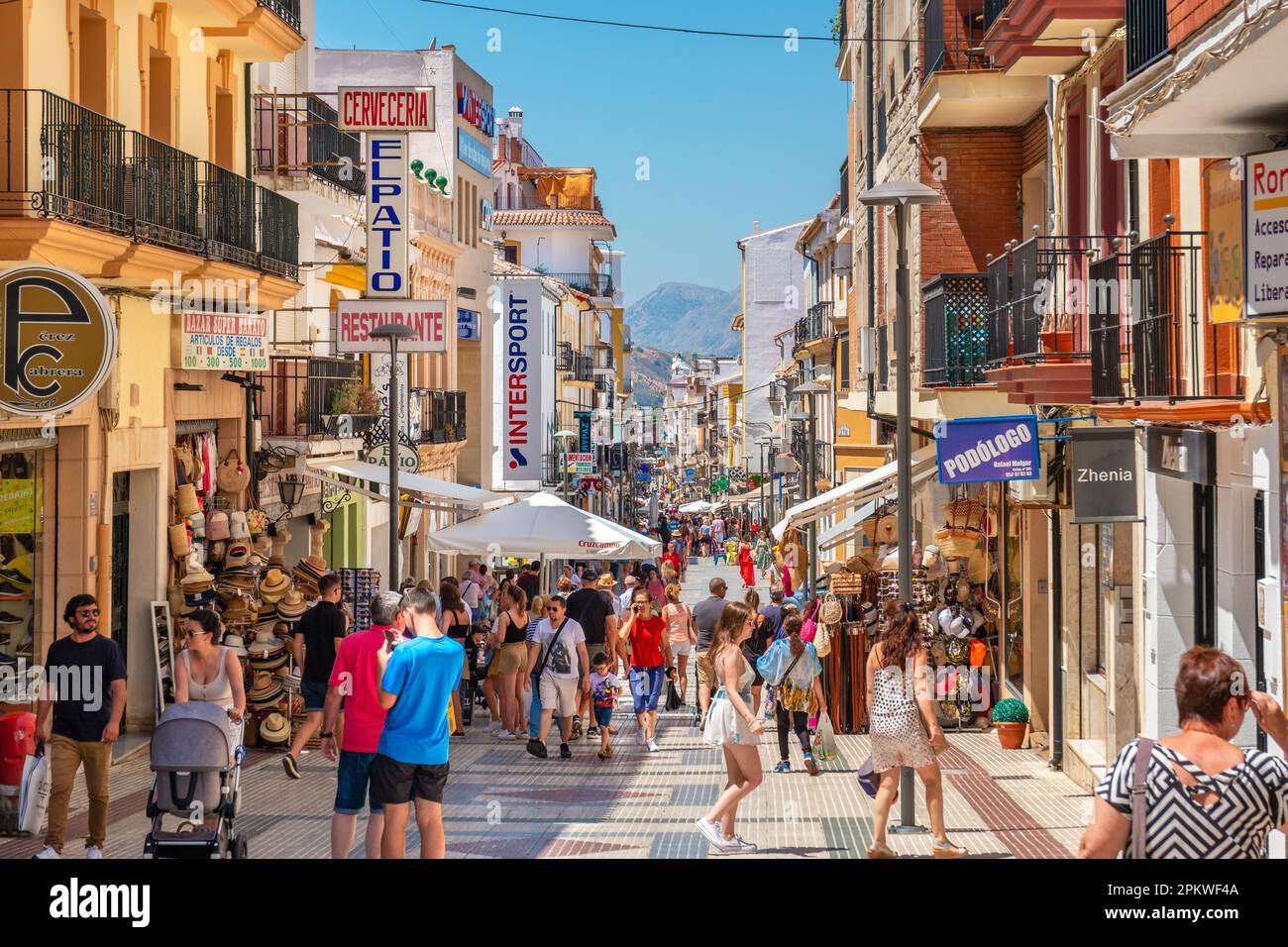 Busy pedestrian street Carrera Espinel in the center of Ronda ...