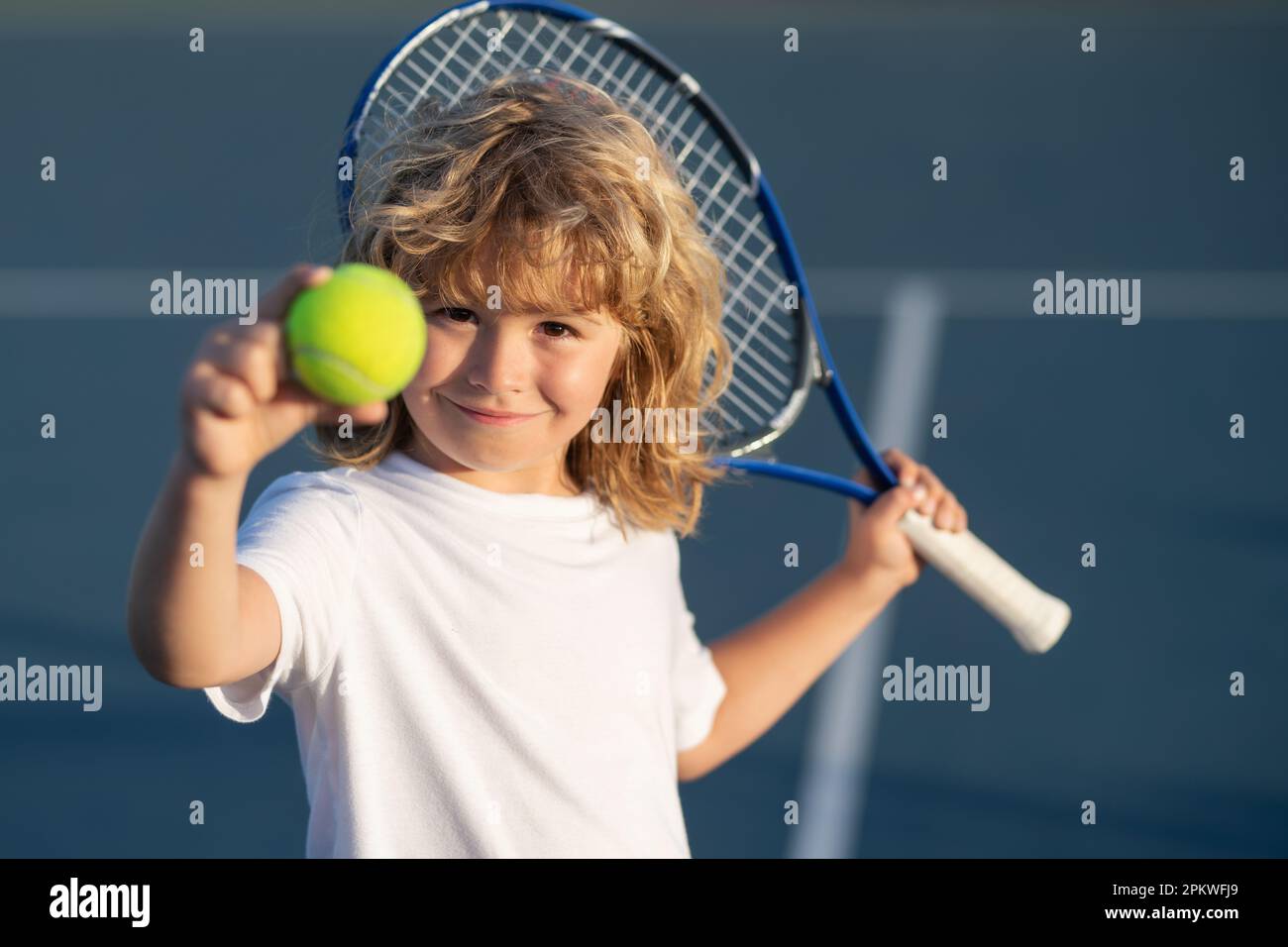 Tennis kid. Child with tennis racket and tennis ball playing on tennis ...