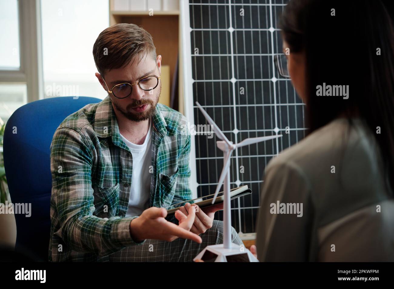 Project manager discussing wind turbine characteristics Stock Photo - Alamy