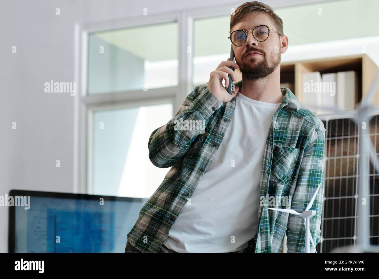 Solar energy sales manager talking to client on phone Stock Photo - Alamy