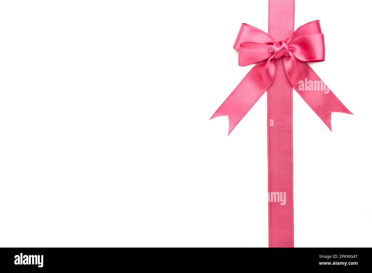 Pink ribbon with bow isolated on a white background. Top view Stock ...