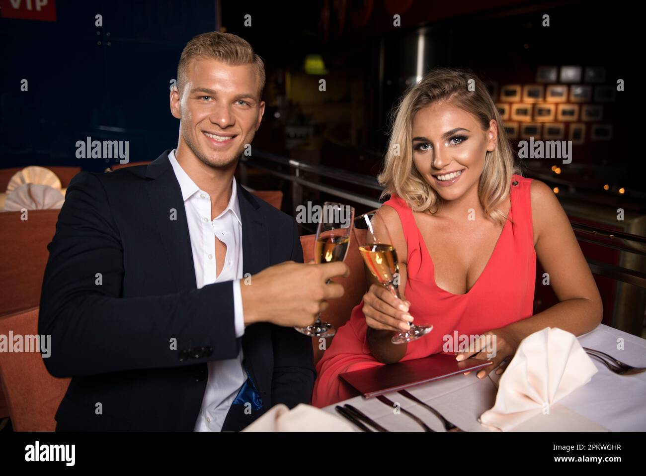 Romantic Couple Friends Eating At A Restaurant Table Toasting With ...