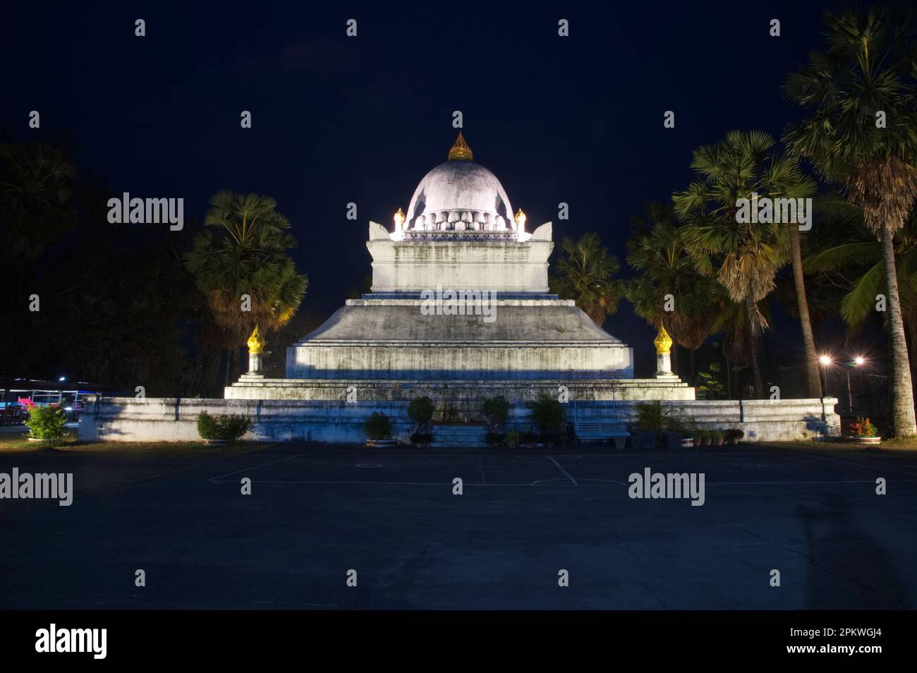 Scene of night time at the Lotus Stupa also known as "That Pathum" is ...