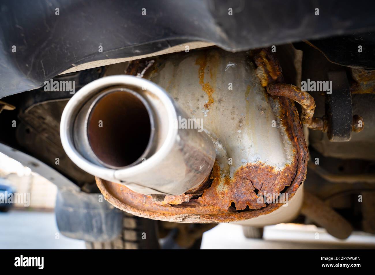 Corrosion on the muffler of a car, close-up. Rusty metal on the bottom of the car Stock Photo ...
