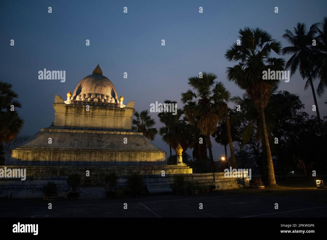 Scene of twilight at the Lotus Stupa also known as "That Pathum" is one ...