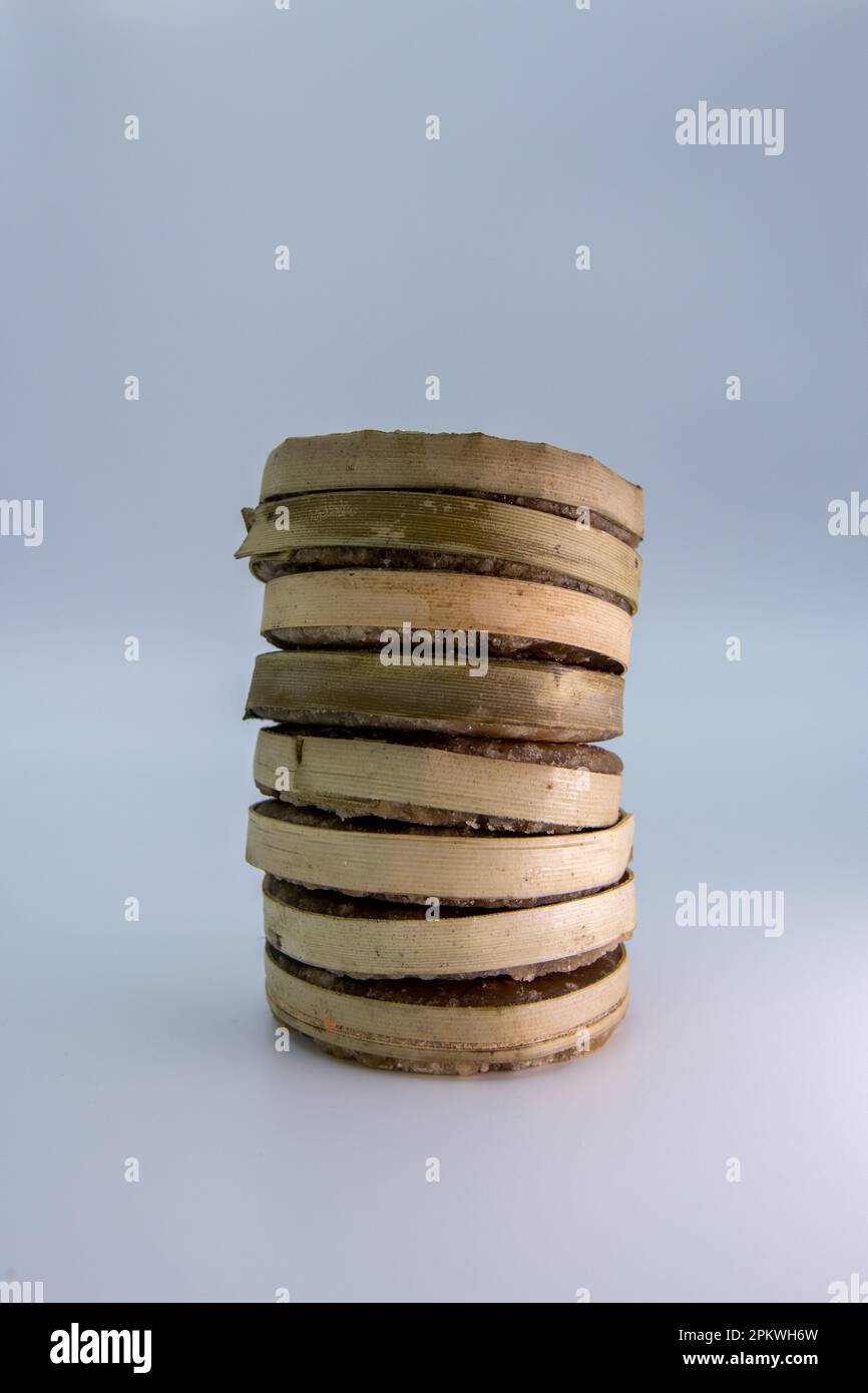 The palm jaggery isolated on white background Stock Photo - Alamy